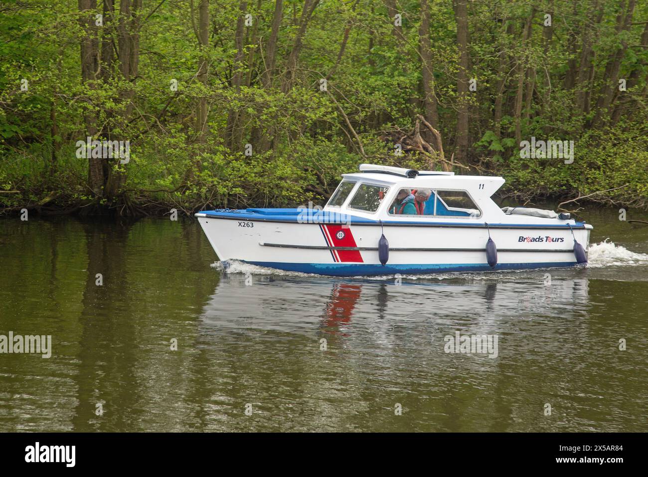 Wroxham, Norfolk, England, April, 2024 landscape format shot of a boat ...