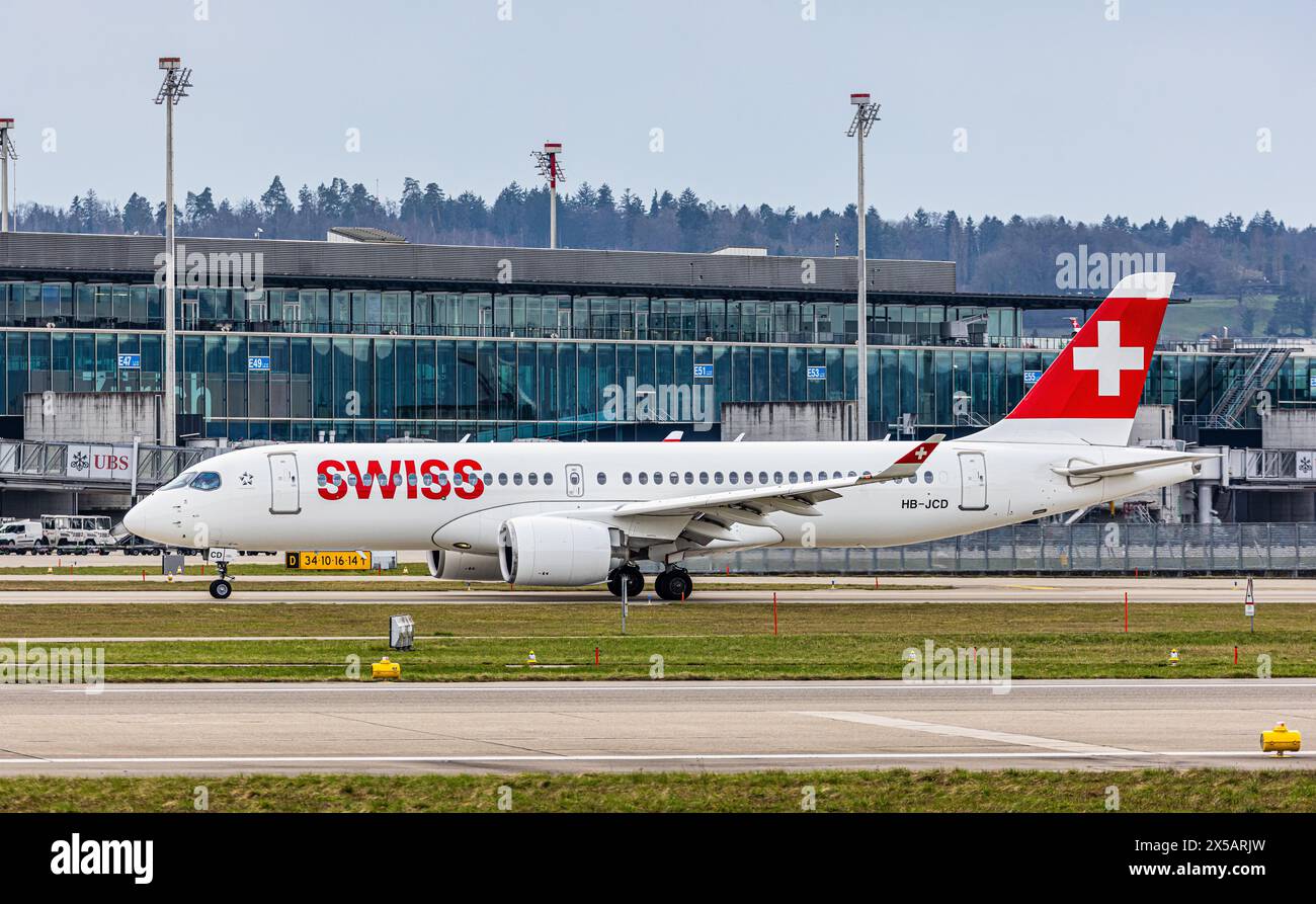 A Swiss International Airlines Airbus A220-300 taxis to the terminal ...