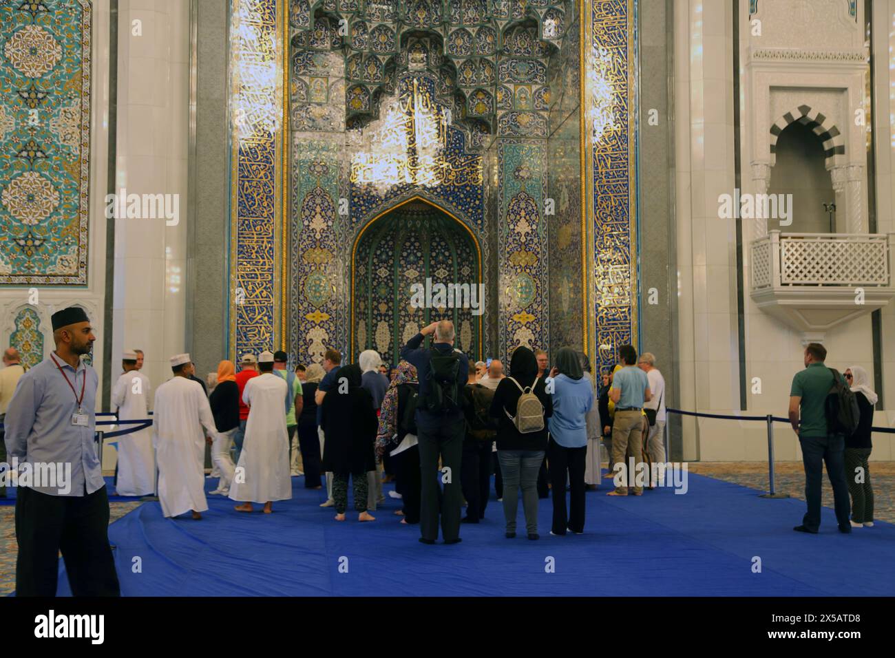 Sultan Qaboos Grand Mosque Interior Tourists Standing on the Protective ...
