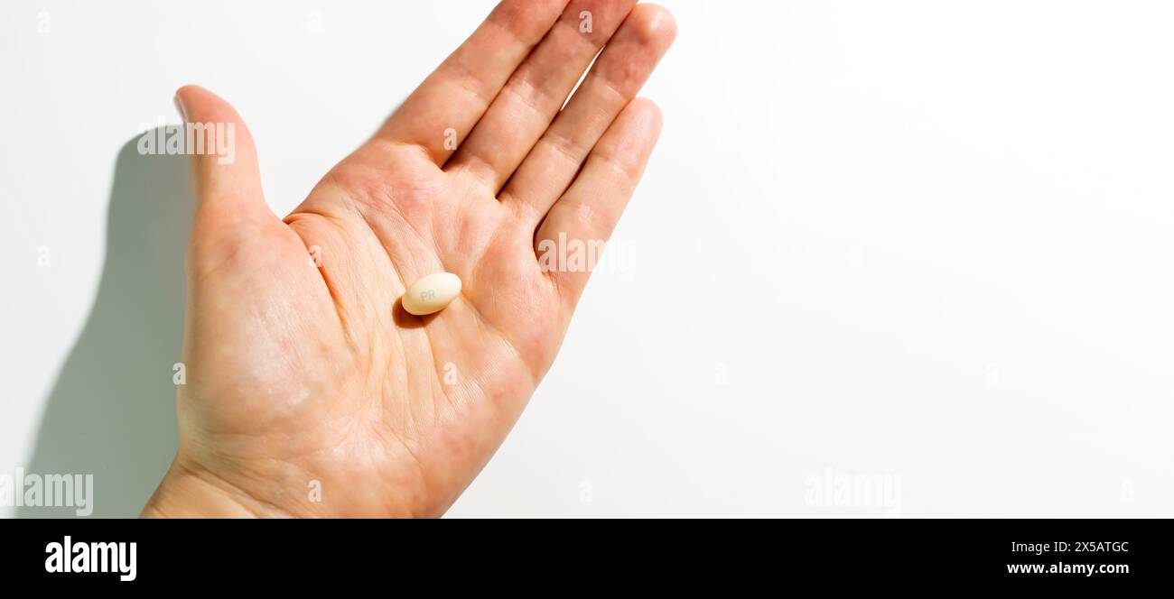 Design Progesterone Pill, Capsules In Human Hand On White Background ...