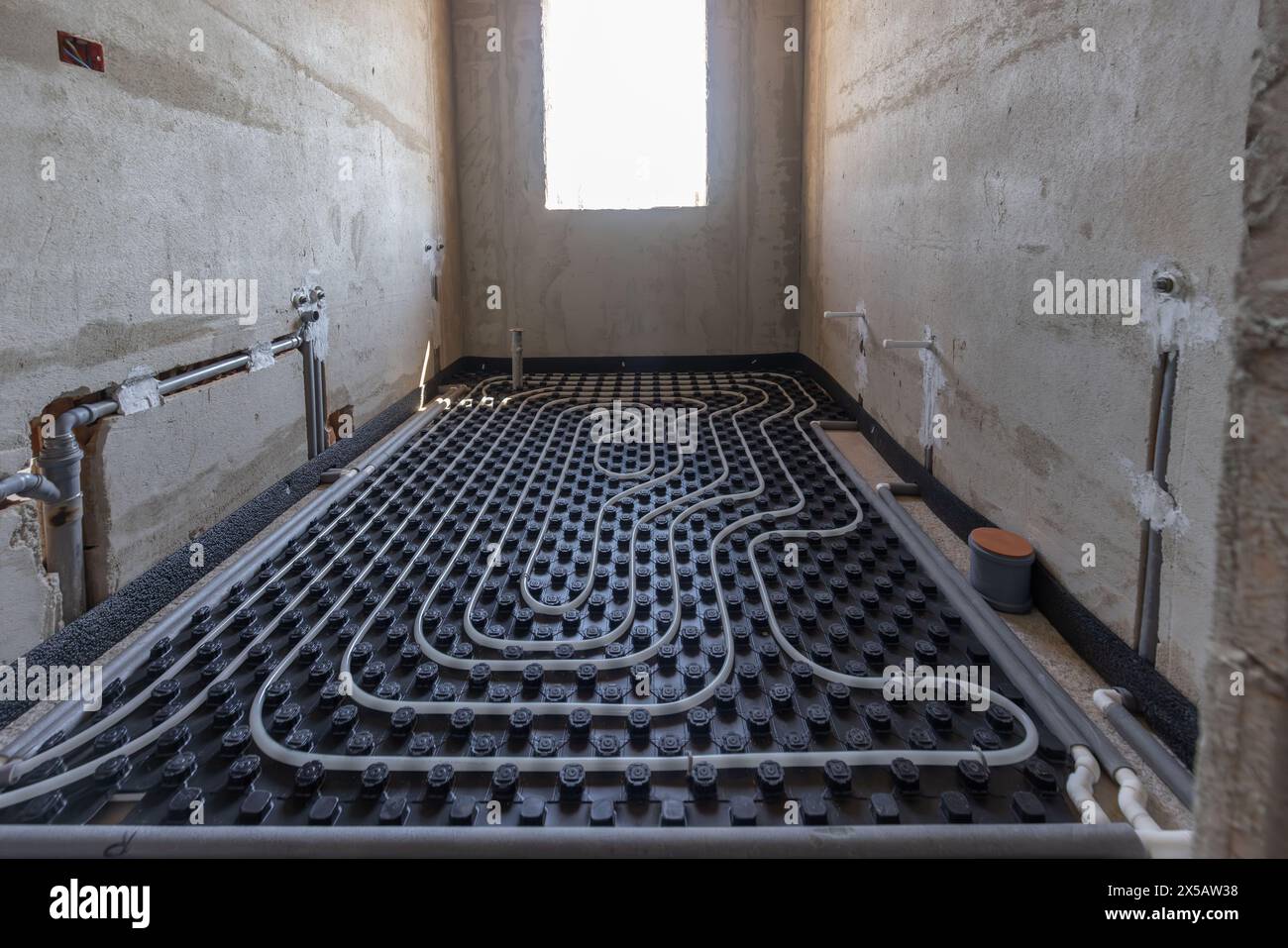View of a modern underfloor heating system with pipes and insulation ...