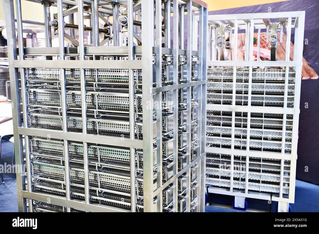 Loading device for industrial food press systems Stock Photo - Alamy