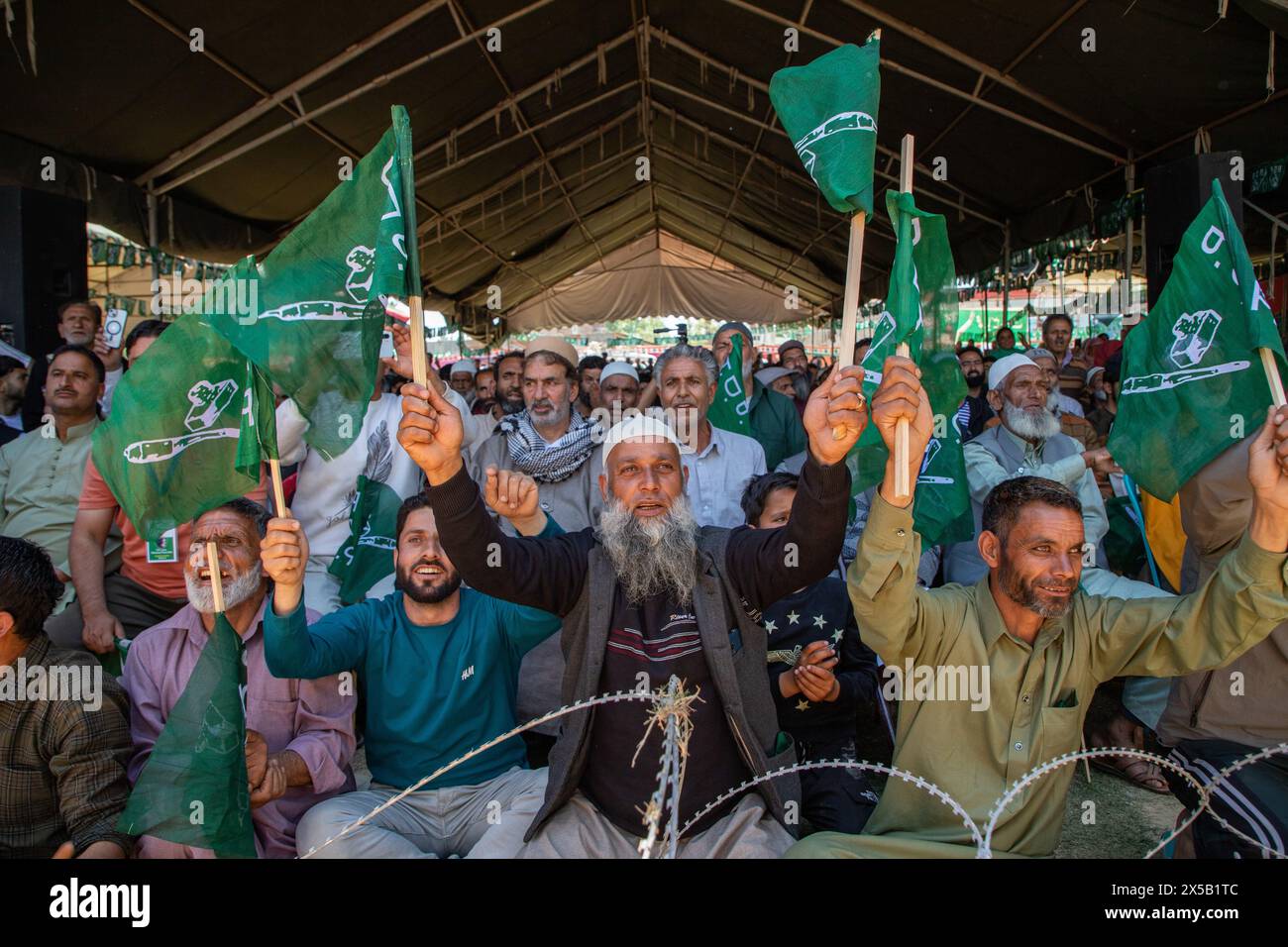 Supporters of the Jammu and Kashmir Peoples Democratic Party (PDP) hold ...