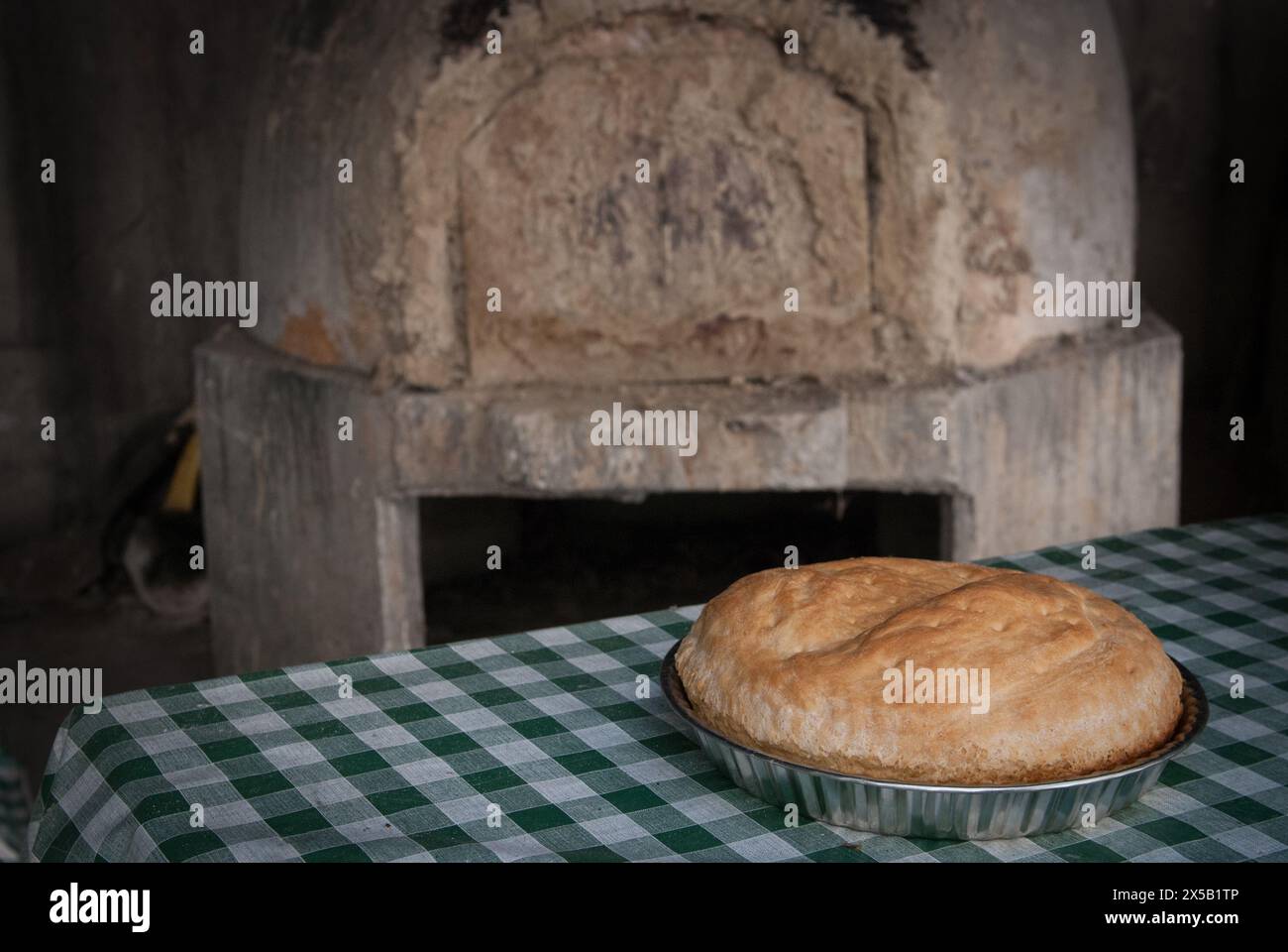 Fresh homemade bread cooked on a traditional clay oven. Home bakery ...