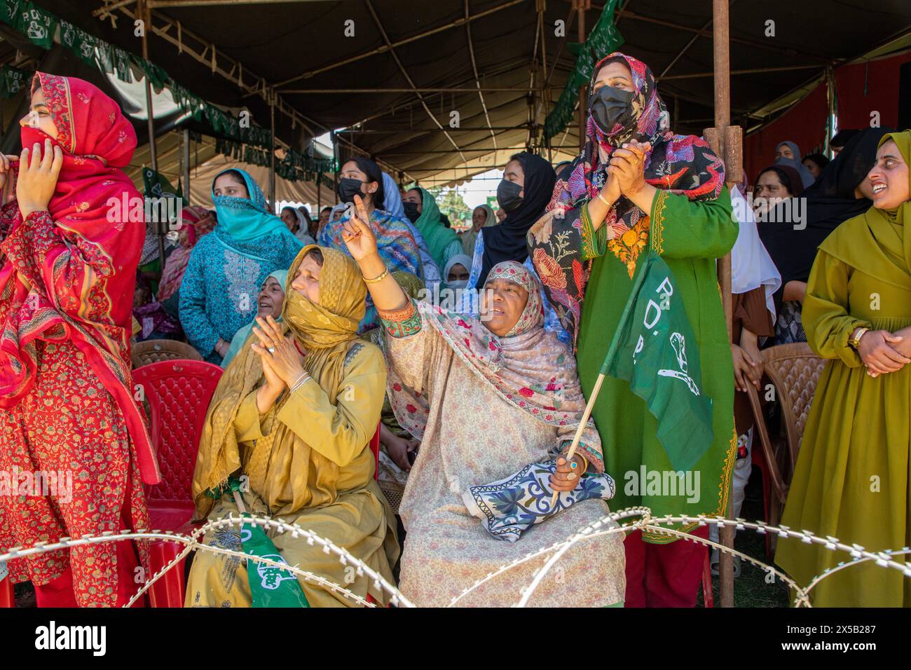 Supporters of the Jammu and Kashmir Peoples Democratic Party (PDP) hold ...