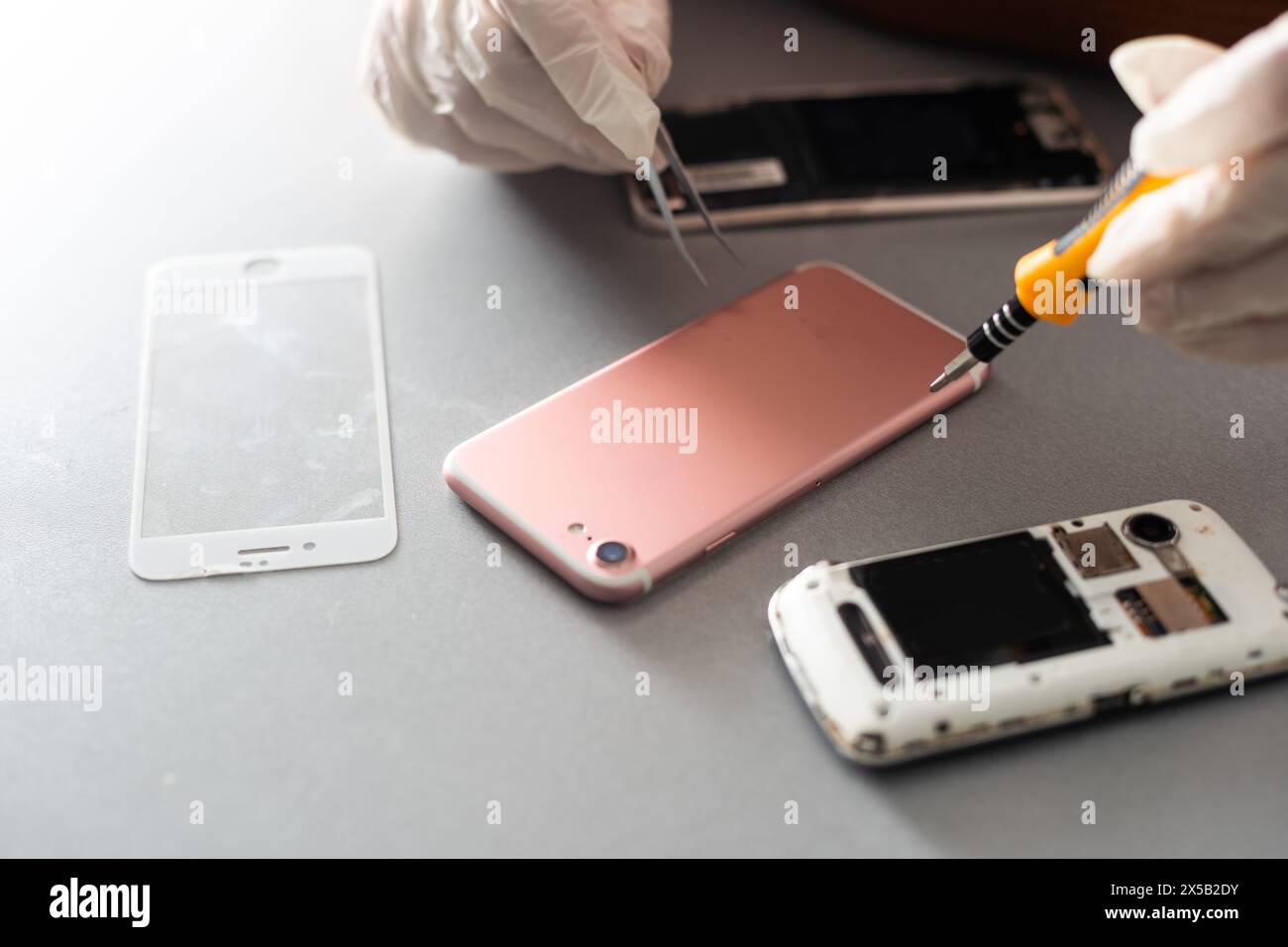 Close-up photos showing process of mobile phone repair Stock Photo - Alamy