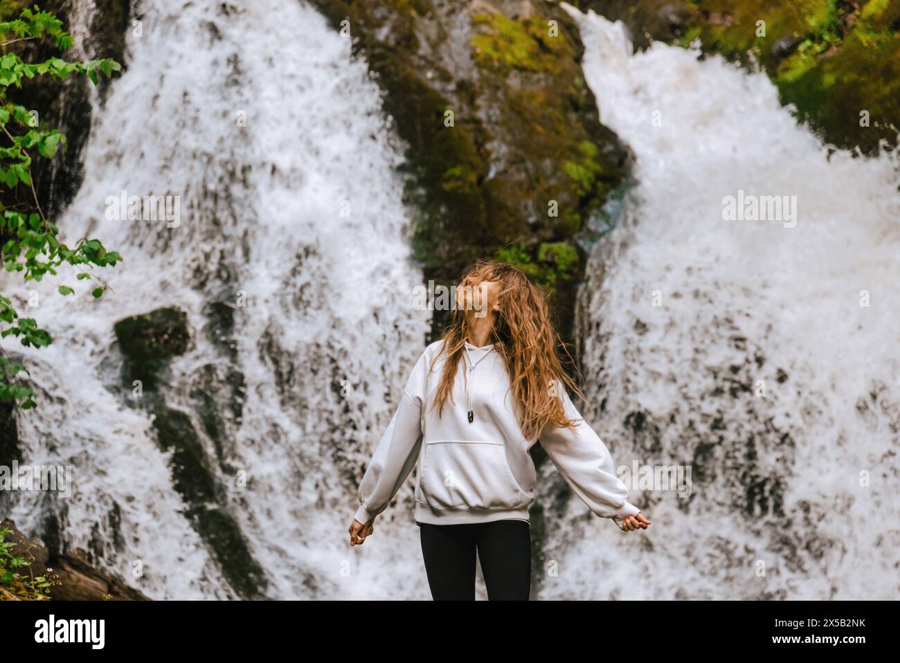 Woman Traveler Enjoying Mountain Waterfall Landscape Stock Photo - Alamy