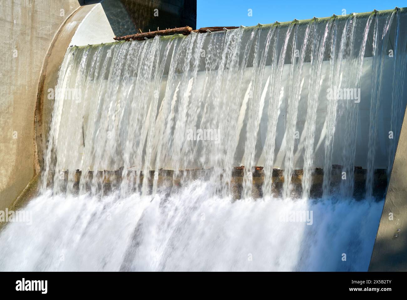 Dam Spillway Water Rushing. A dam spillway as the water pours over the ...