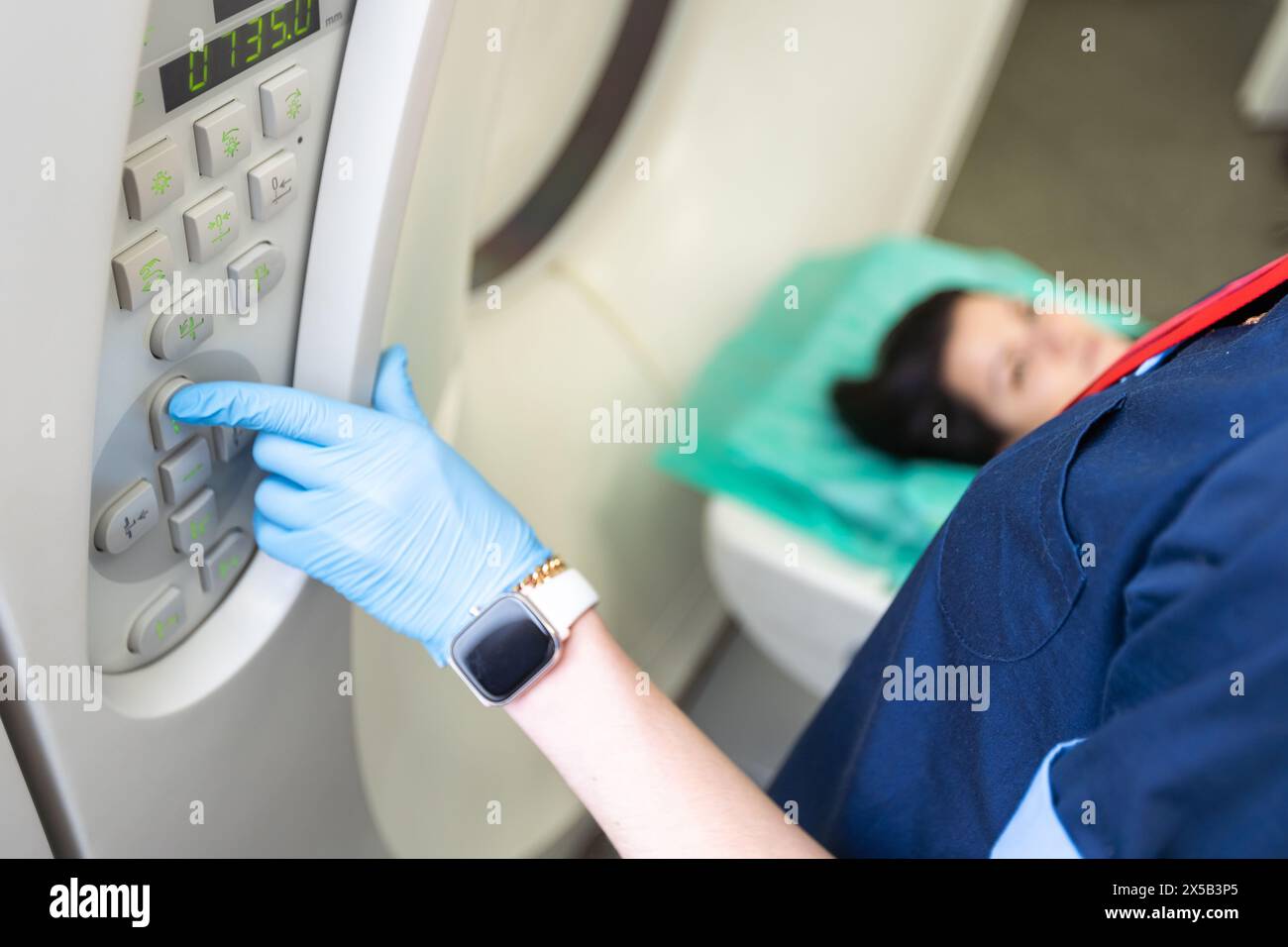 beautiful woman lying on ct scanner bed during tomography test in ...