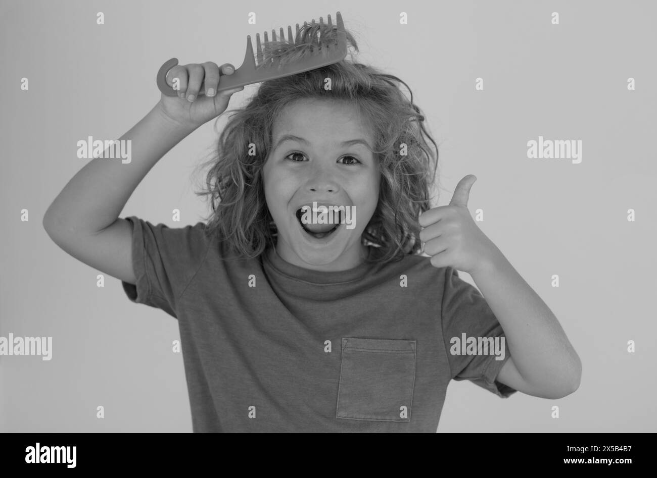 Hair kids concept. Funny hairstyle. Child with a comb and problem hair ...