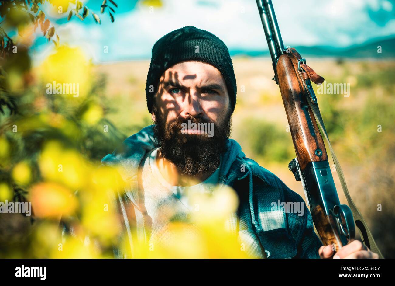 Portrait of hamdsome Hunter. Hunter with shotgun gun on hunt. Man ...