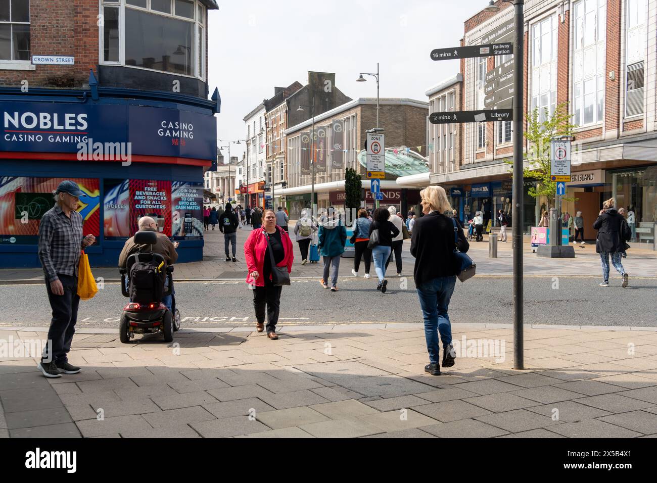 People shopping in the town centre in Darlington, UK. UK retail and ...