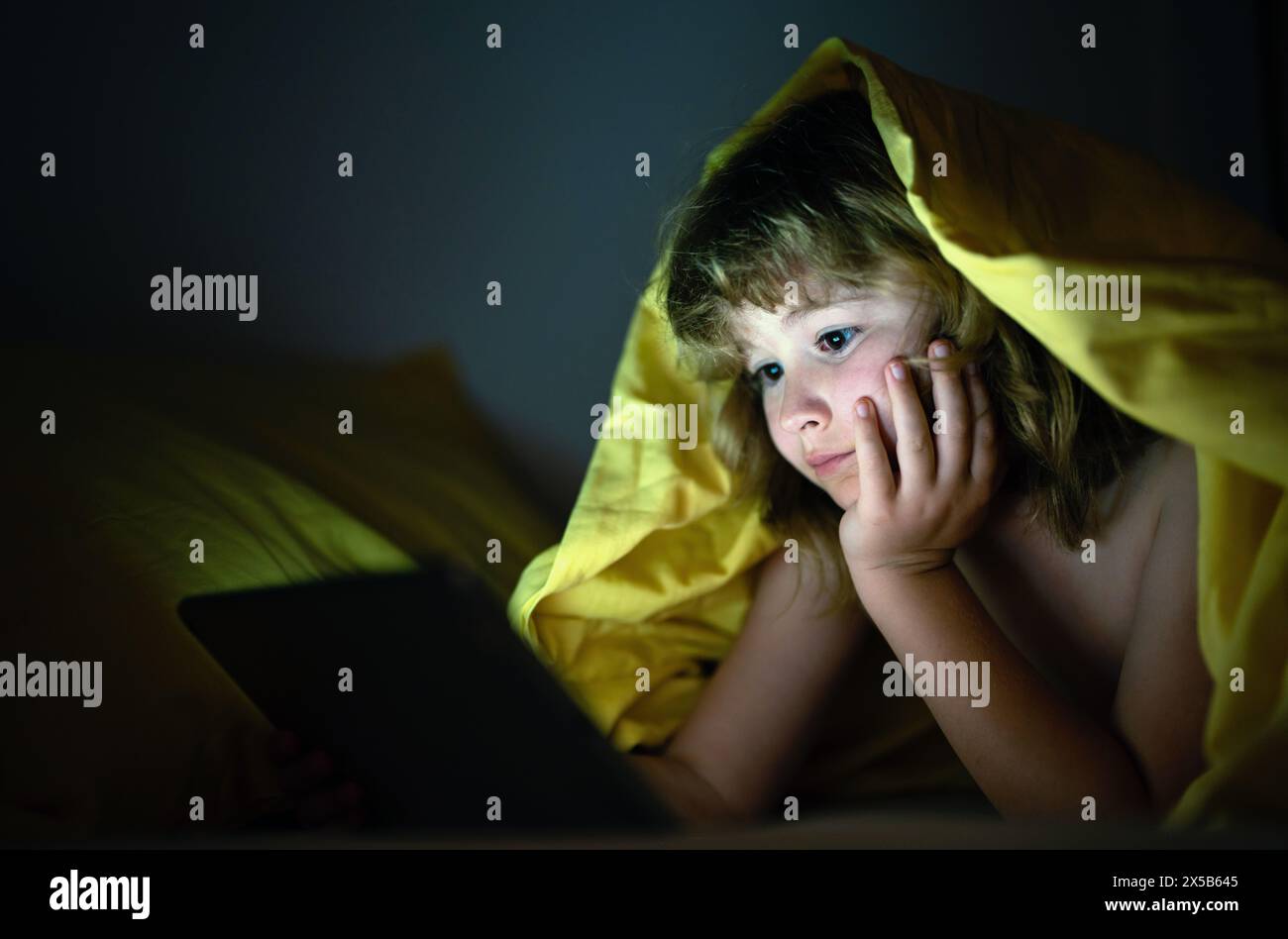 Kid is addicted to tablet, kid use tablet, watching cartoon. Child ...