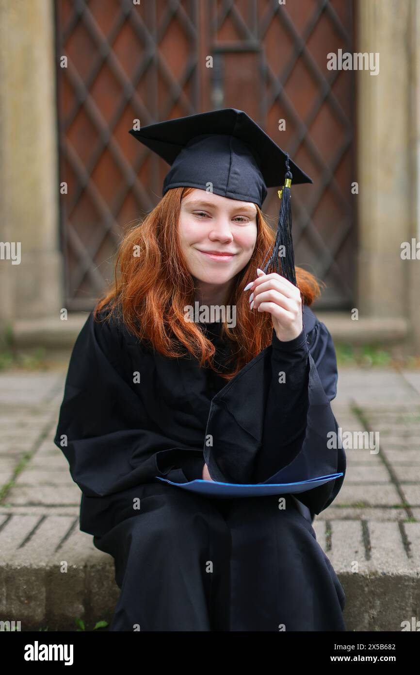 Celebrating graduation ceremony concept. Portrait of happy student girl ...
