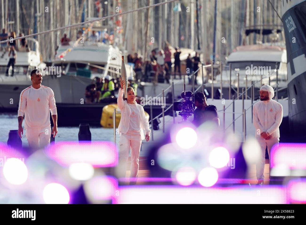 French Paralympic athlete Nantenin Keïta, center, holds the Olympic ...