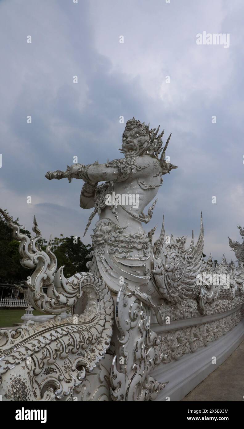A statue of a guardian and dragon protecting the gateway to heaven at ...