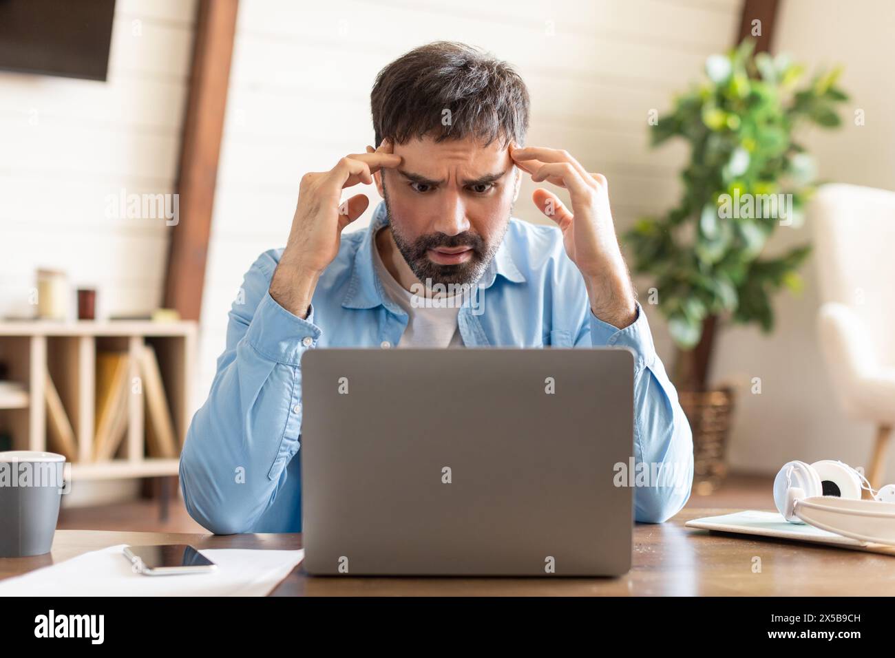 Frustrated Man With Beard Facing Laptop Issues in Home Office Stock ...