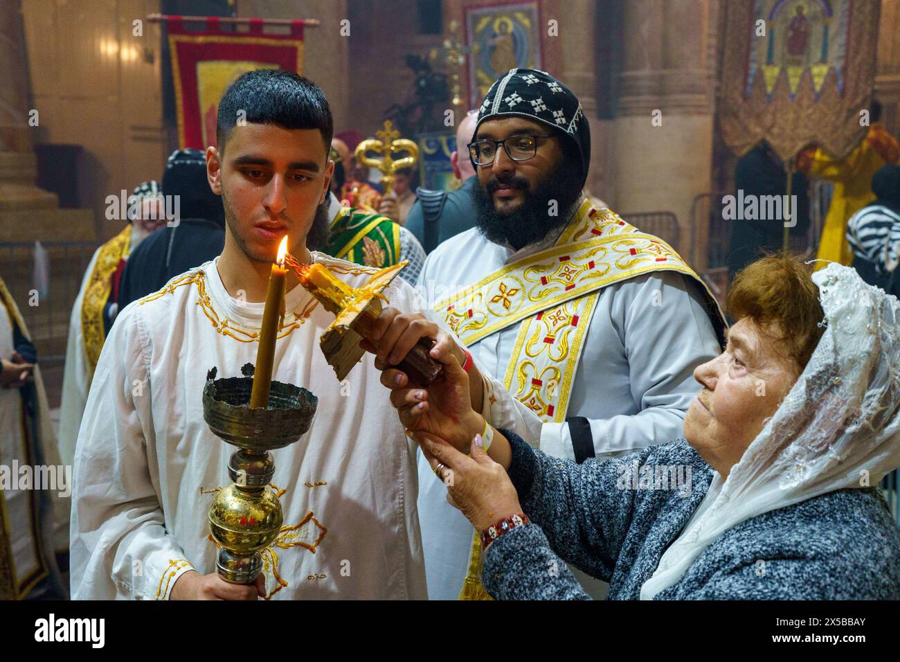 The Holy Fire is shared between the devotees from candle to candle ...