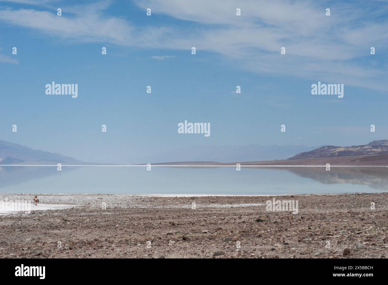 People walking on the Bad Water Basin salt flats where Lake Manly ...