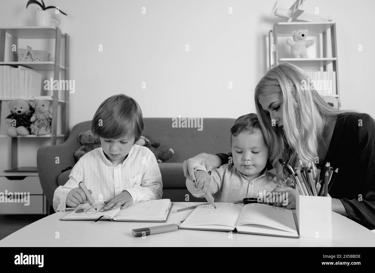 Kids preschool two children drawing Black and White Stock Photos ...