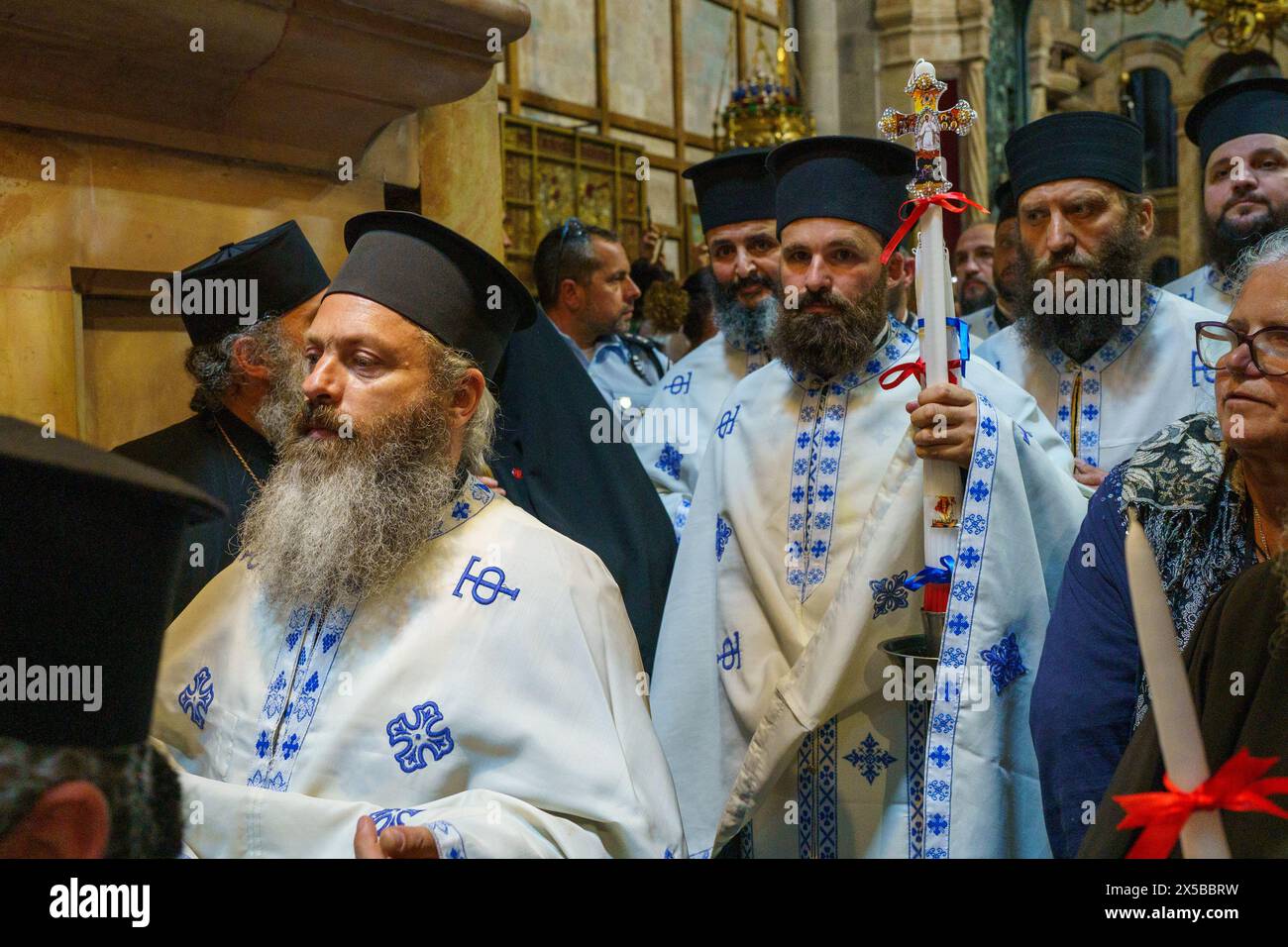 The entourage of the Greek Patriarch walks into the Church of the Holy ...