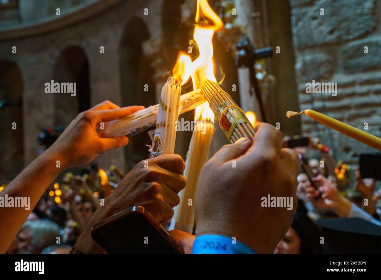 The Holy Fire is shared between devotees from candle to candle during ...