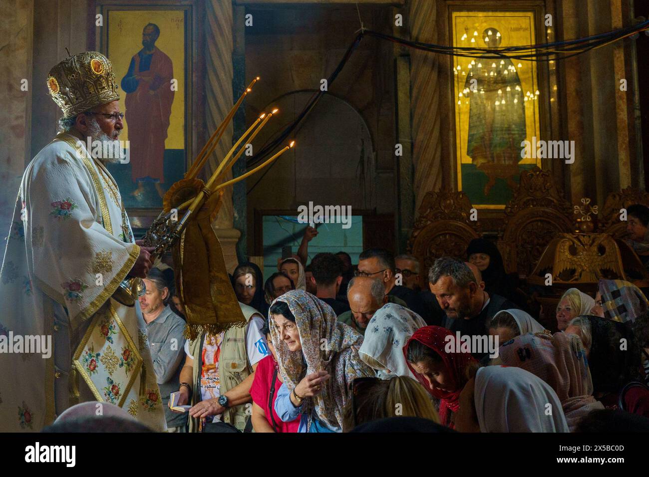 An Orthodox clergyman and devotees seen during a special prayer ...