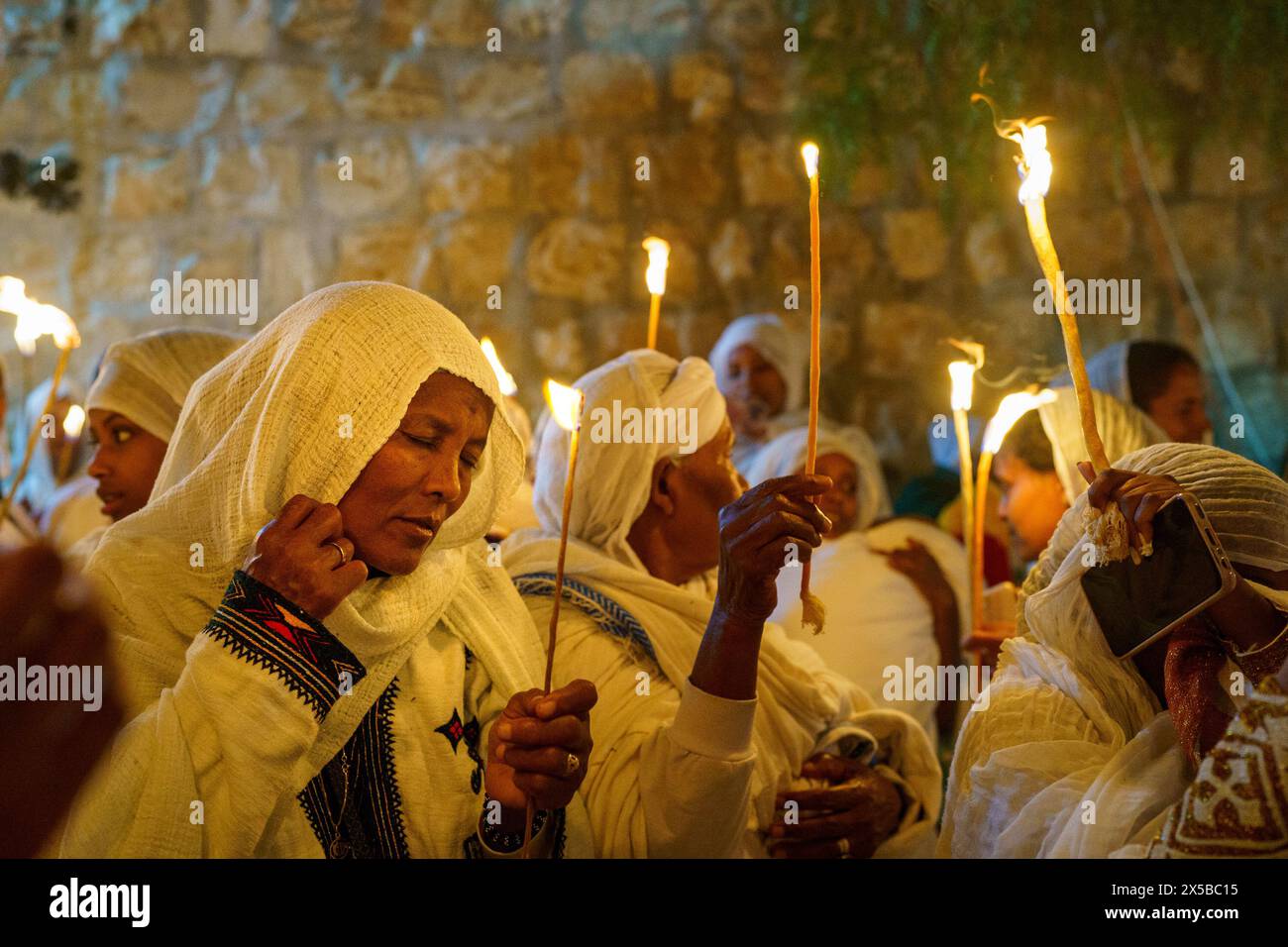 May 4, 2024, Jerusalem, Israel: An Ethiopian woman holds a candle while ...