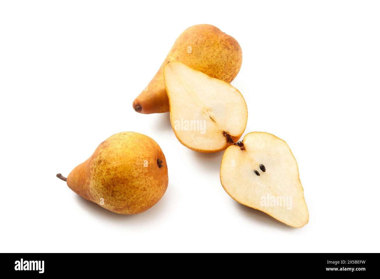 Two whole and halves of ripe juicy pear fruits with soft shadow ...