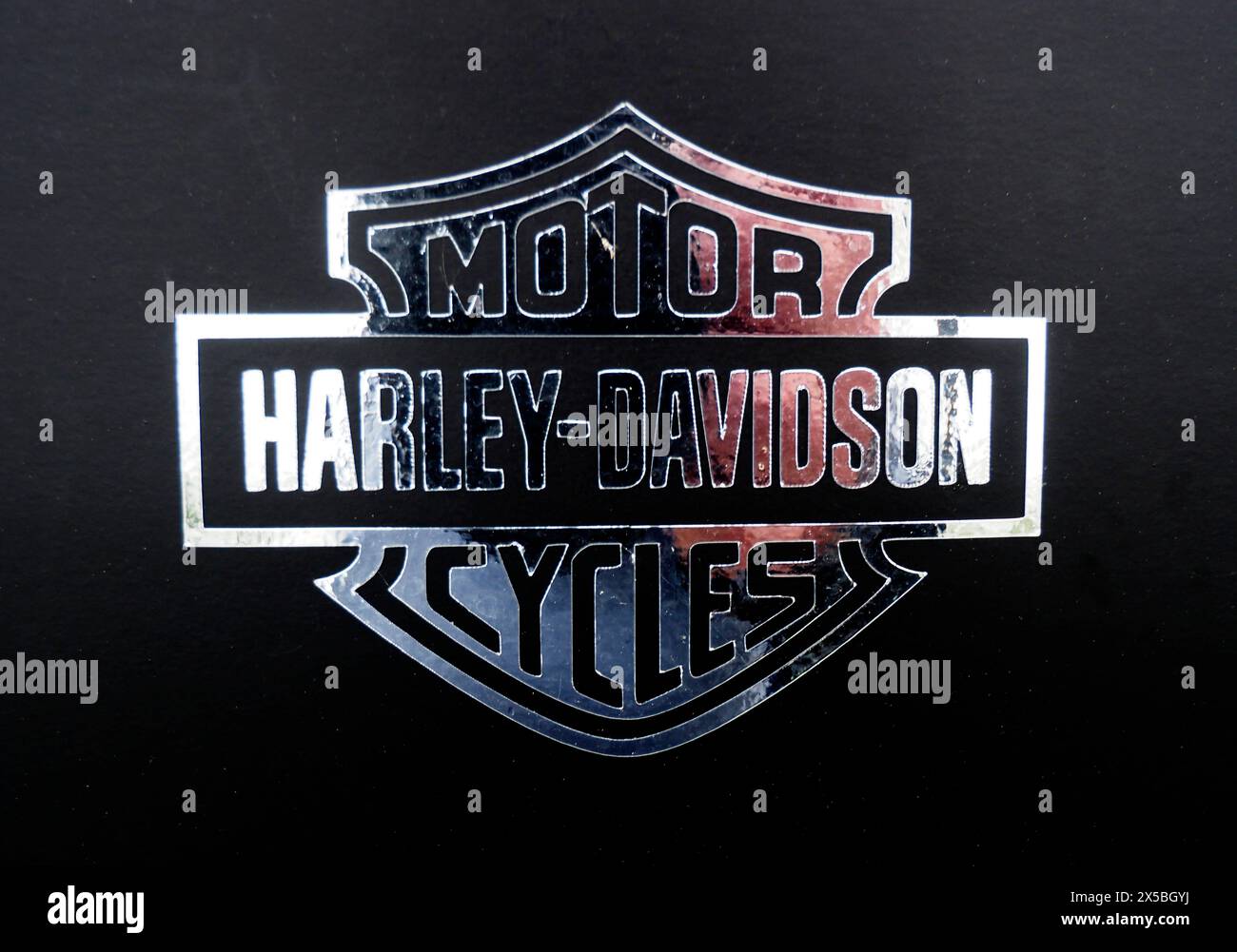Silver Harley-Davidson logo on a black background. - A traditional ...