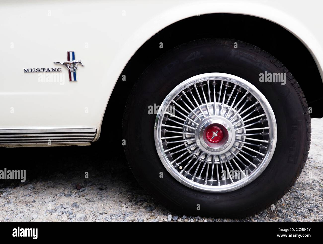 Front wheel and emblem of a 1965 Ford Mustang. The first production ...