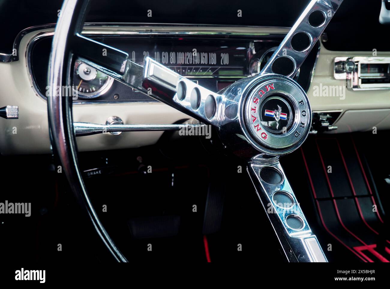 Steering wheel and dashboard of a 1965 Ford Mustang. The first ...