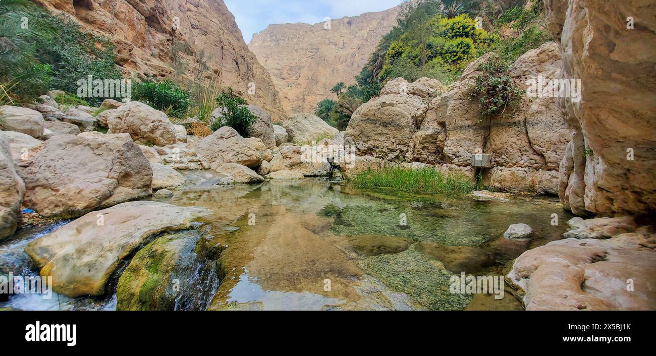 Turquoise water flowing through the Wadi Shab canyon, Wadi Ash Shab ...