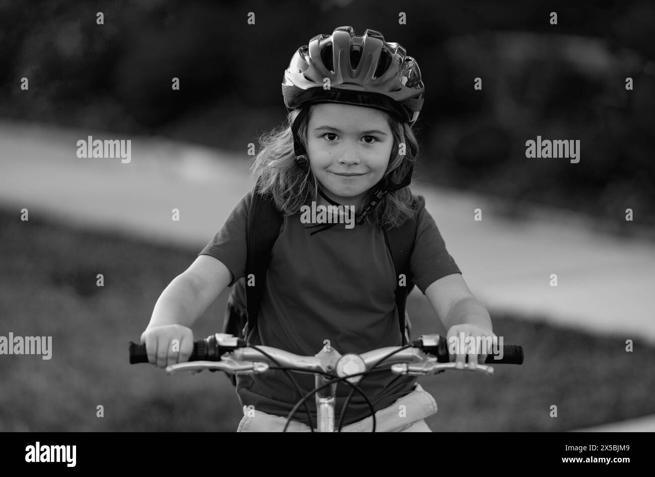 Little kid boy ride a bicycle in the park. Kid cycling on bicycle ...