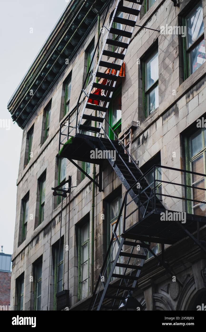 fire escape stairs on old. building in old port montreal Stock Photo ...