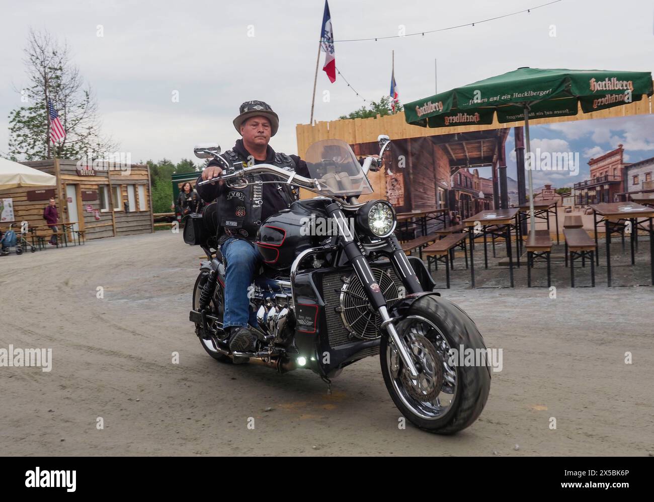A man rides a Harley-Davidson motorcycle. Harley-Davidson Motor Company ...