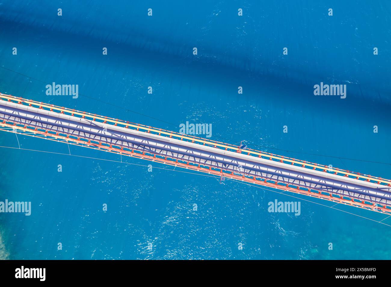 Aerial view of suspension bridge Puente General Carrera, top-down view ...