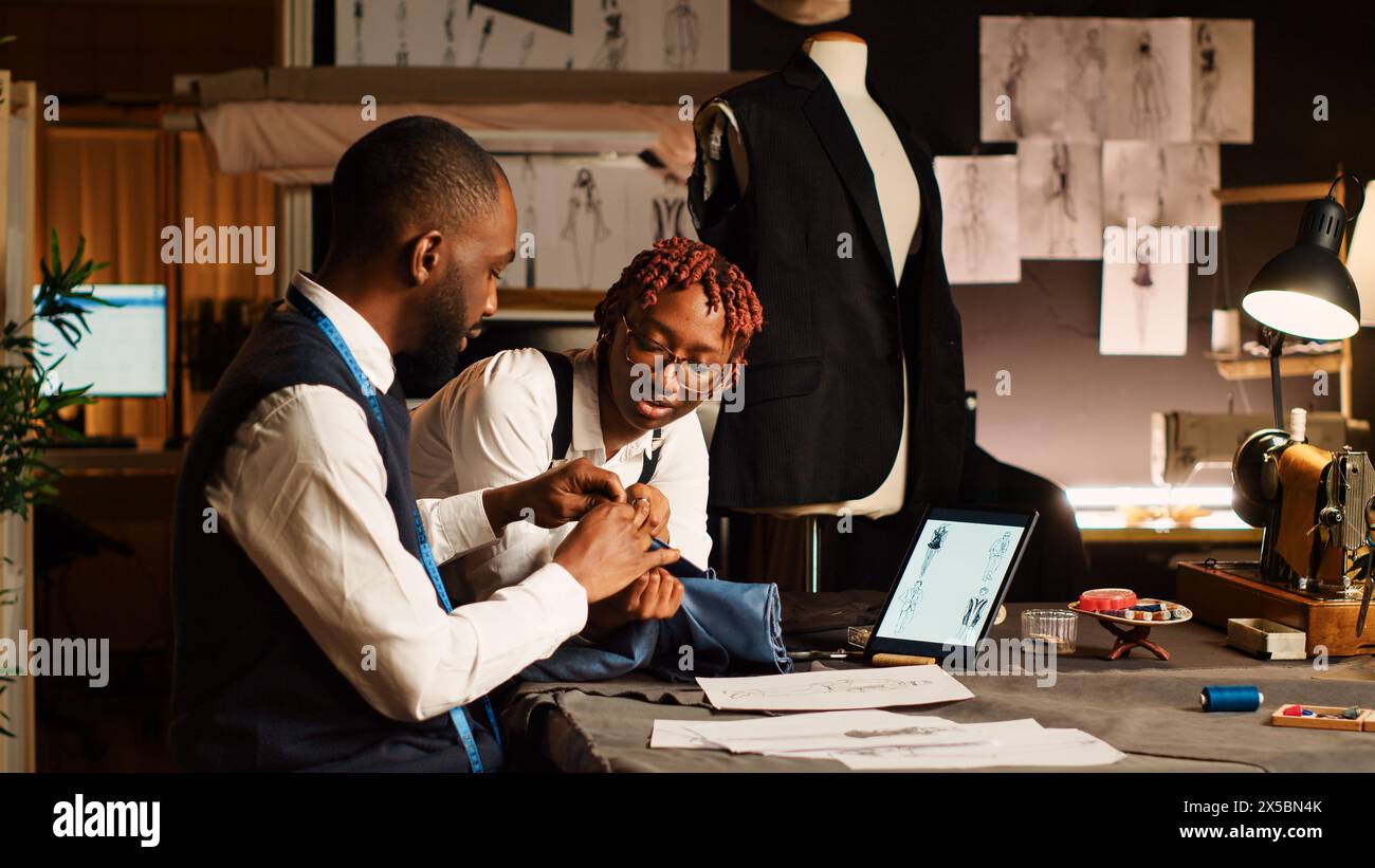 Couturiers team choosing fabric craft hi-res stock photography and ...