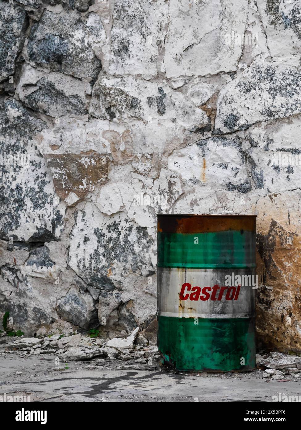 Green and white oil barrel with red Castrol logo on white background ...