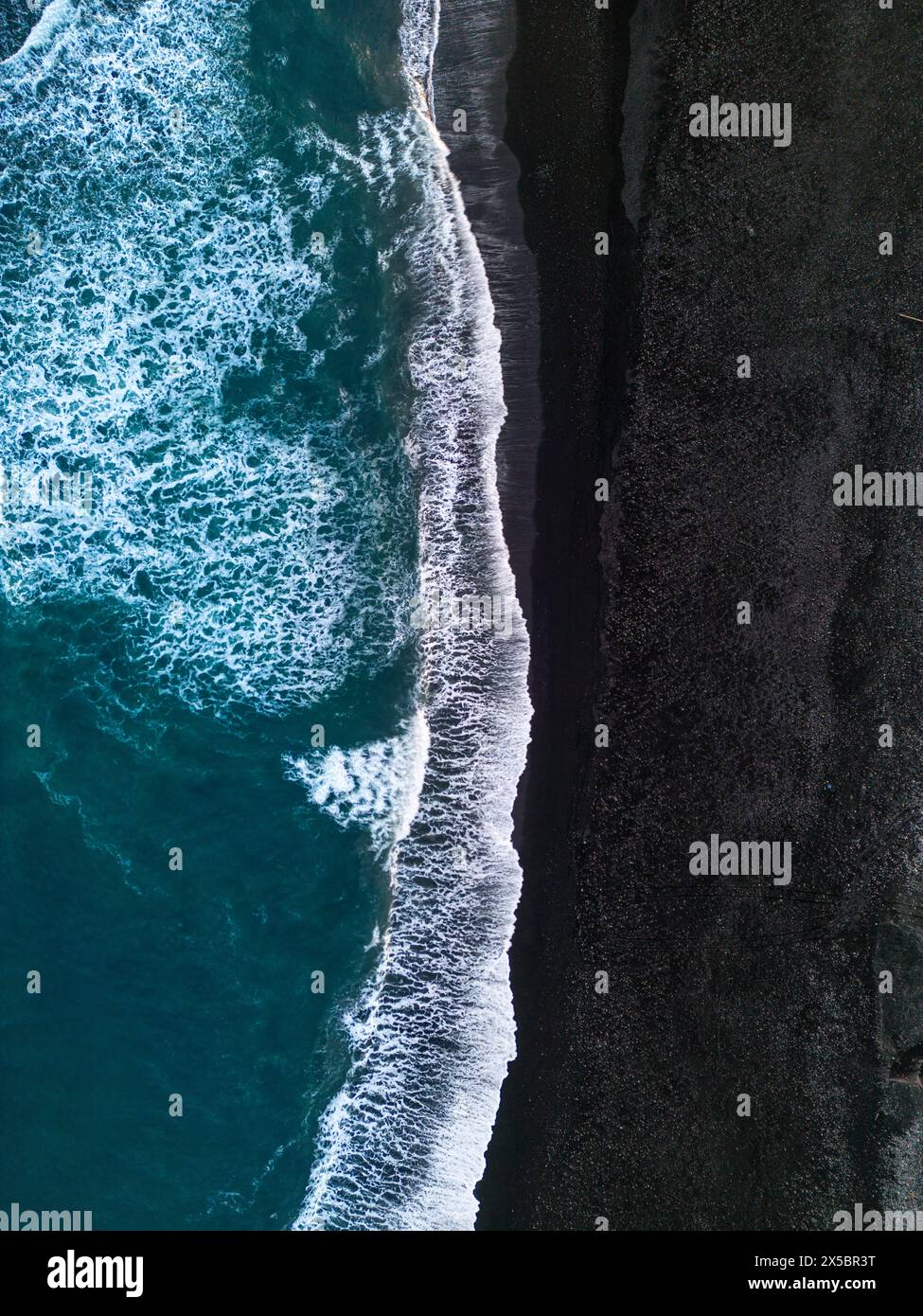Aerial view of Icelandic black sand beach featuring incredible atlantic ...