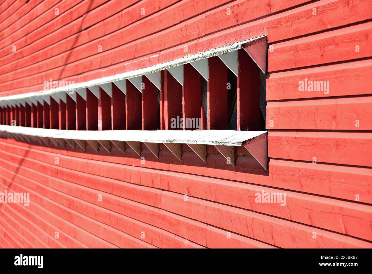 Minimalist picture of red and white repetitive geometrical shapes. Wood ...