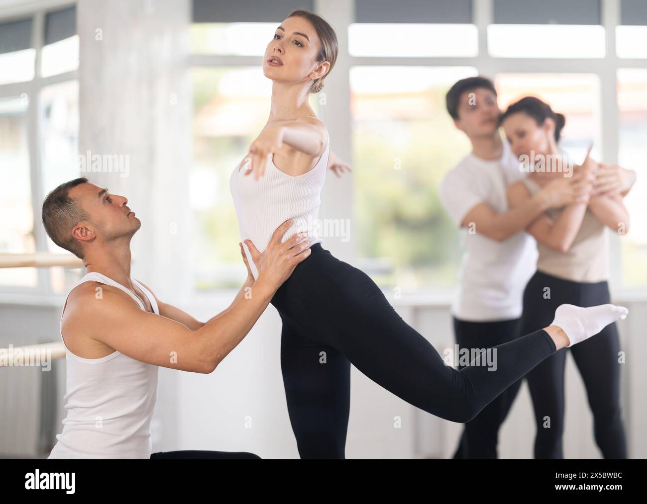 Young man and young woman rehearsing pair ballet Stock Photo - Alamy