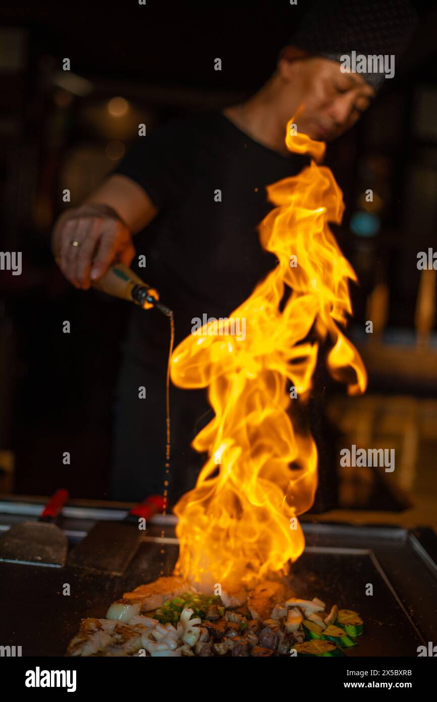 Berlin, Germany 08. 16. 2023. Teppanyaki chef cooking at teppan in a ...