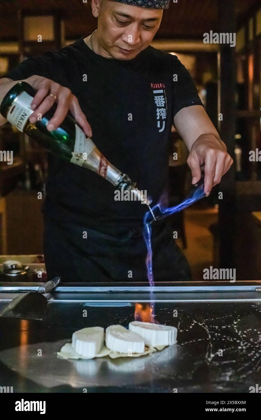 Berlin, Germany 08. 16. 2023. Teppanyaki chef cooking at teppan in a ...