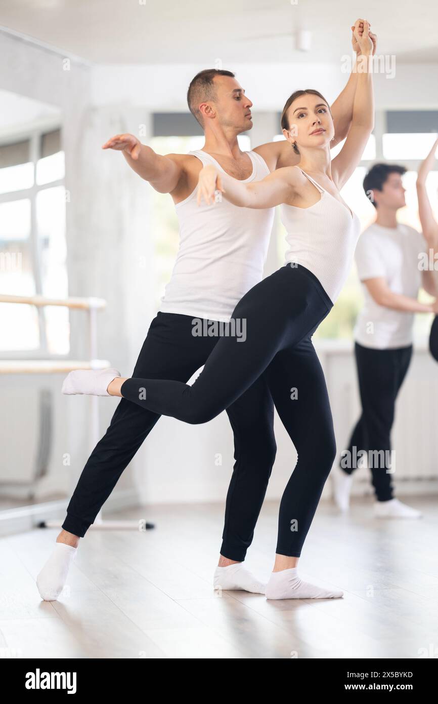 Young man and young woman rehearsing pair ballet Stock Photo - Alamy