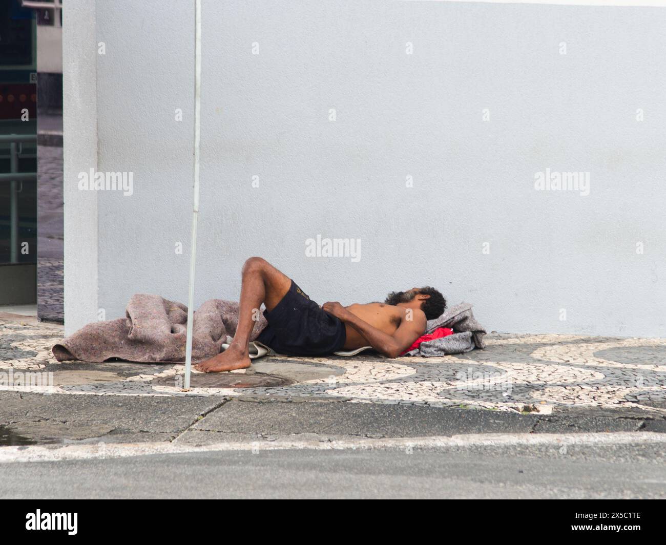 Salvador, Bahia, Brazil - May 12, 2019: Homeless man is seen sleeping ...
