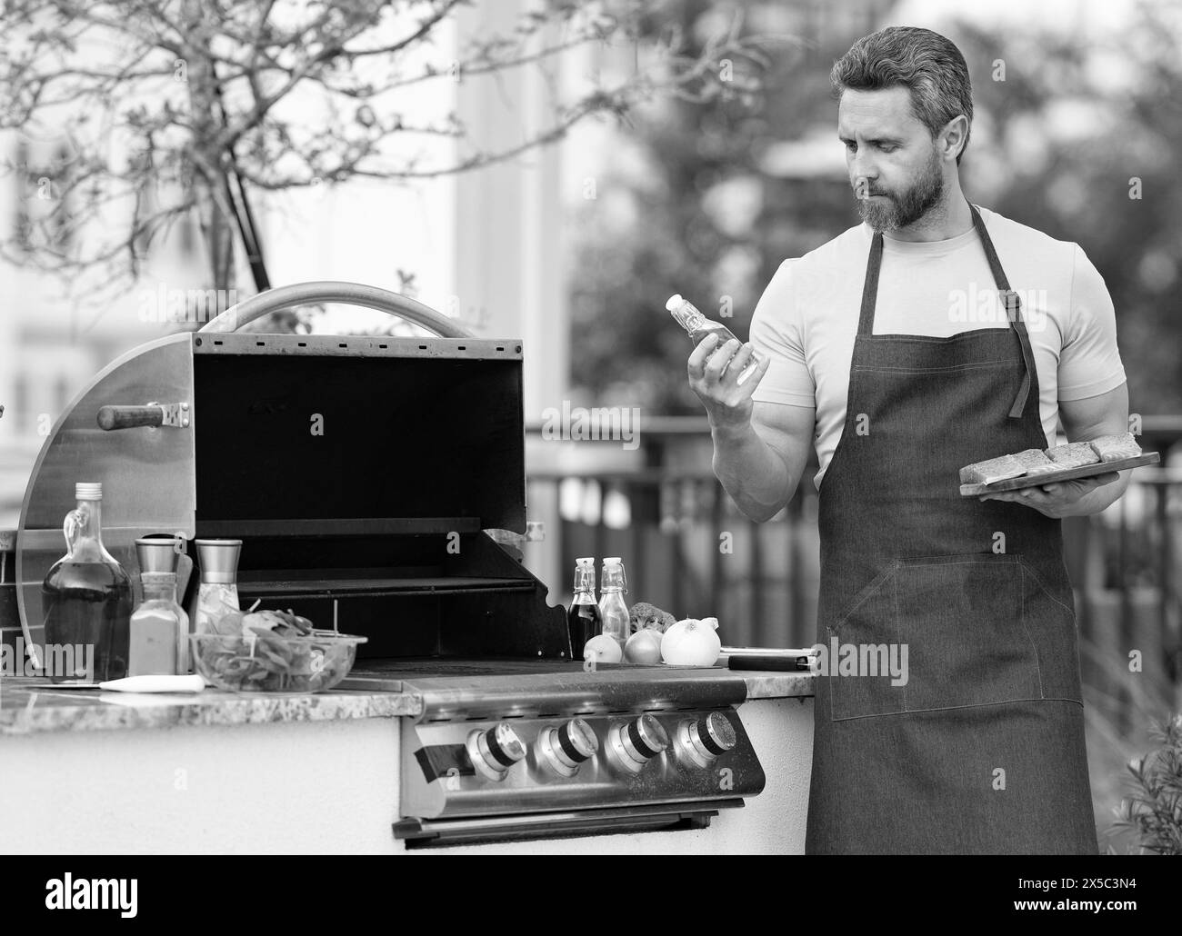 barbecue man with salmon, banner. barbecue man with salmon outdoor ...