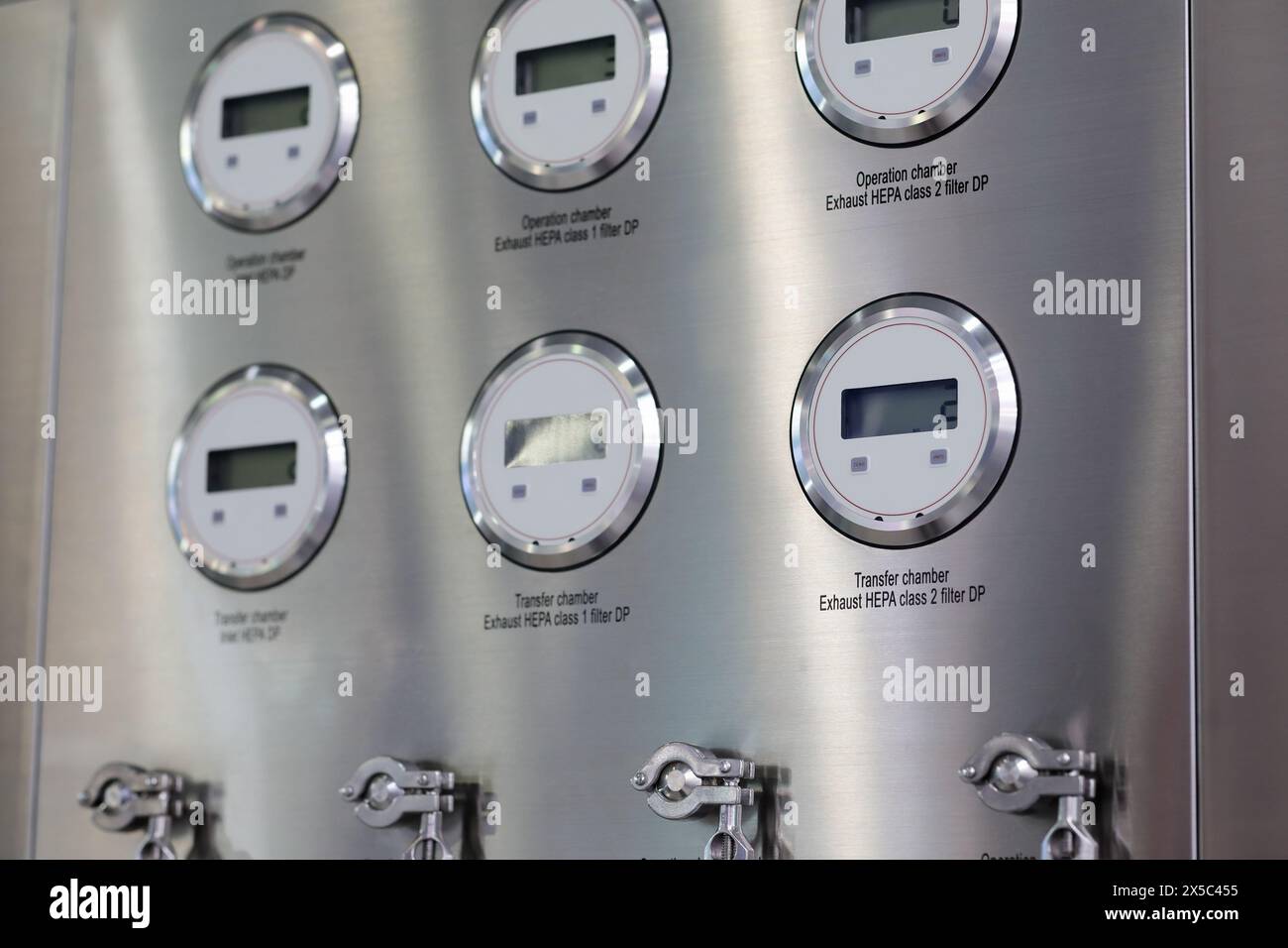 Industrial stainless steel control panel with digital gauges. Selective ...