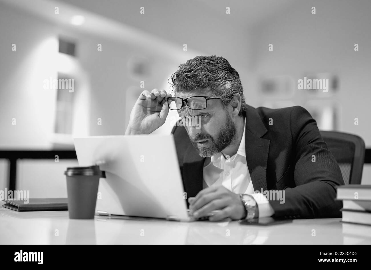 Confident handsome man typing Black and White Stock Photos & Images - Alamy