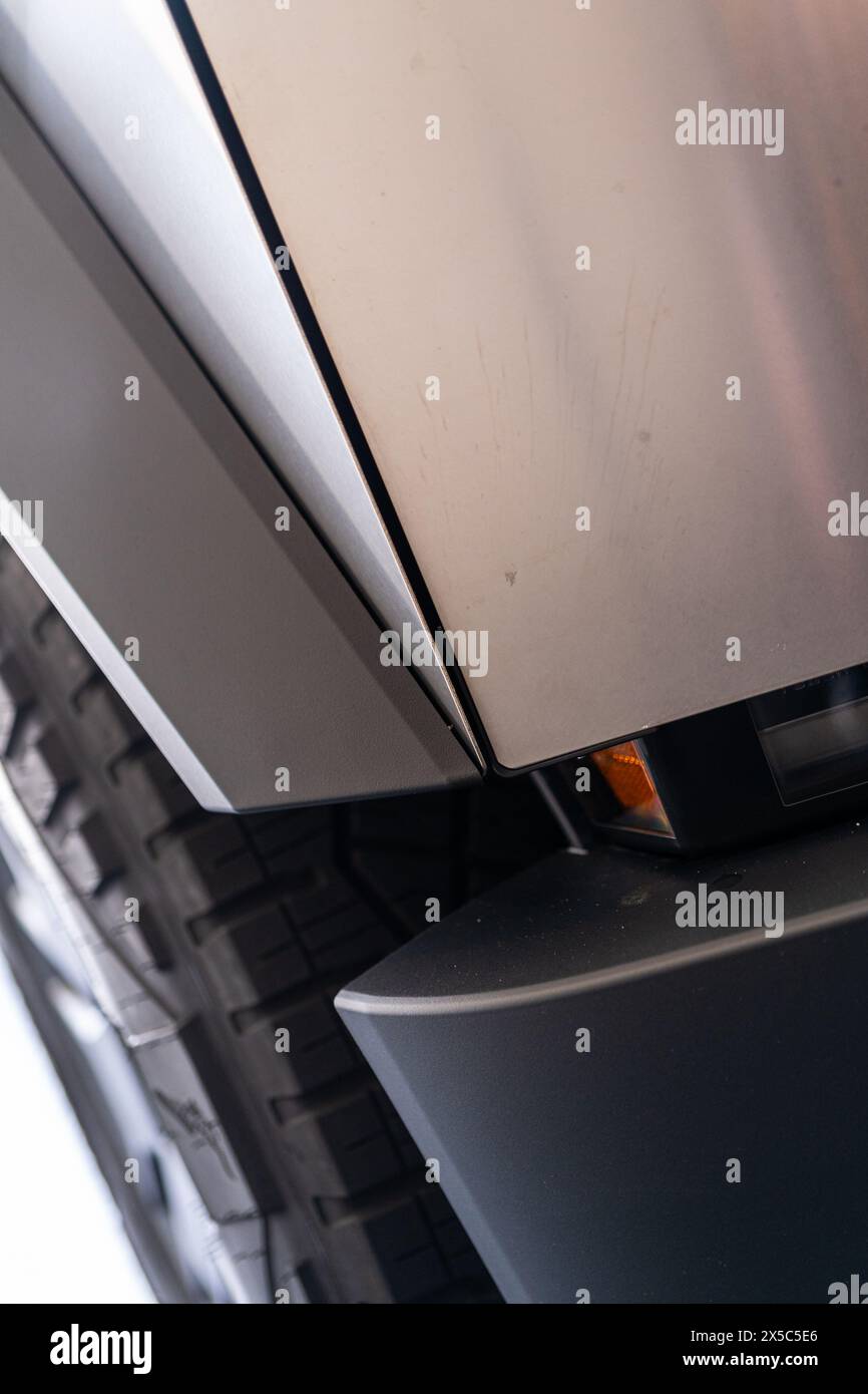 Close-Up View of the Tesla Cybertruck Side Panel and Tire Stock Photo ...